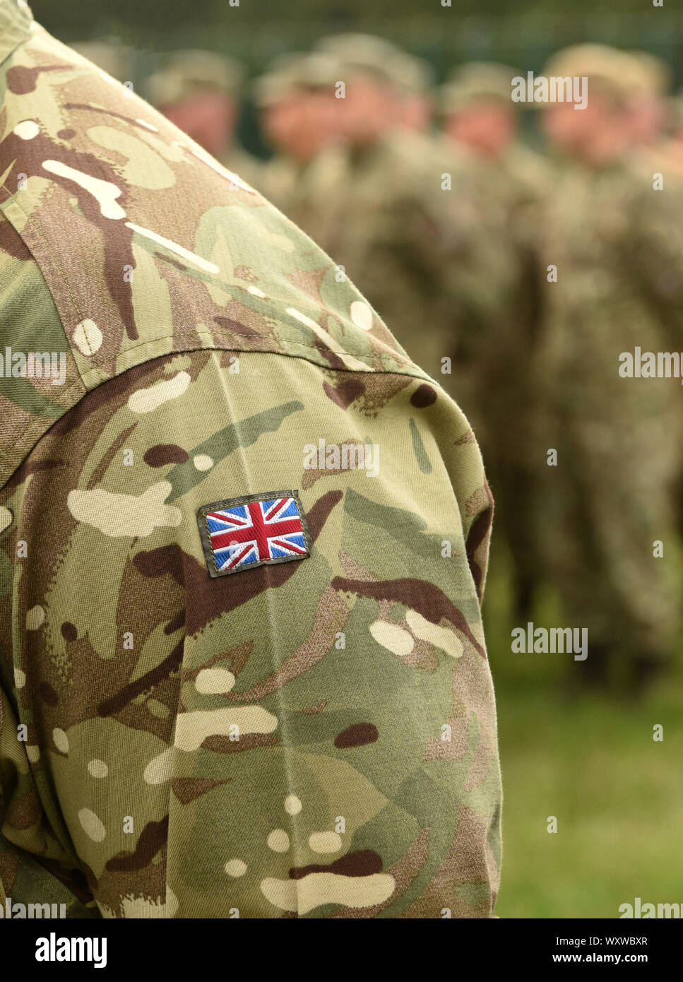 UK flag on soldiers arm. UK military uniform. United Kingdom troops ...