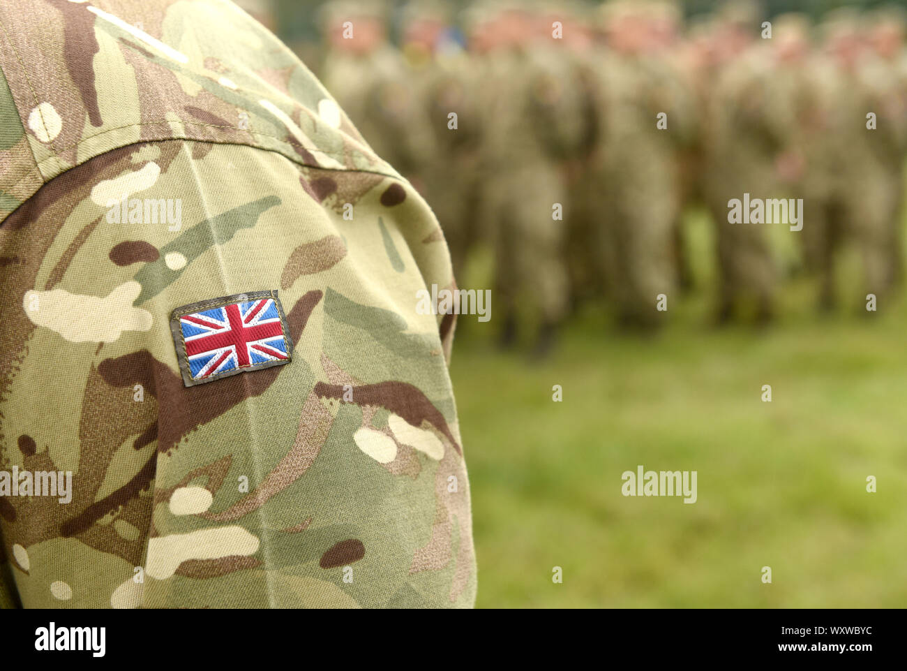 UK flag on soldiers arm. UK military uniform. United Kingdom troops ...
