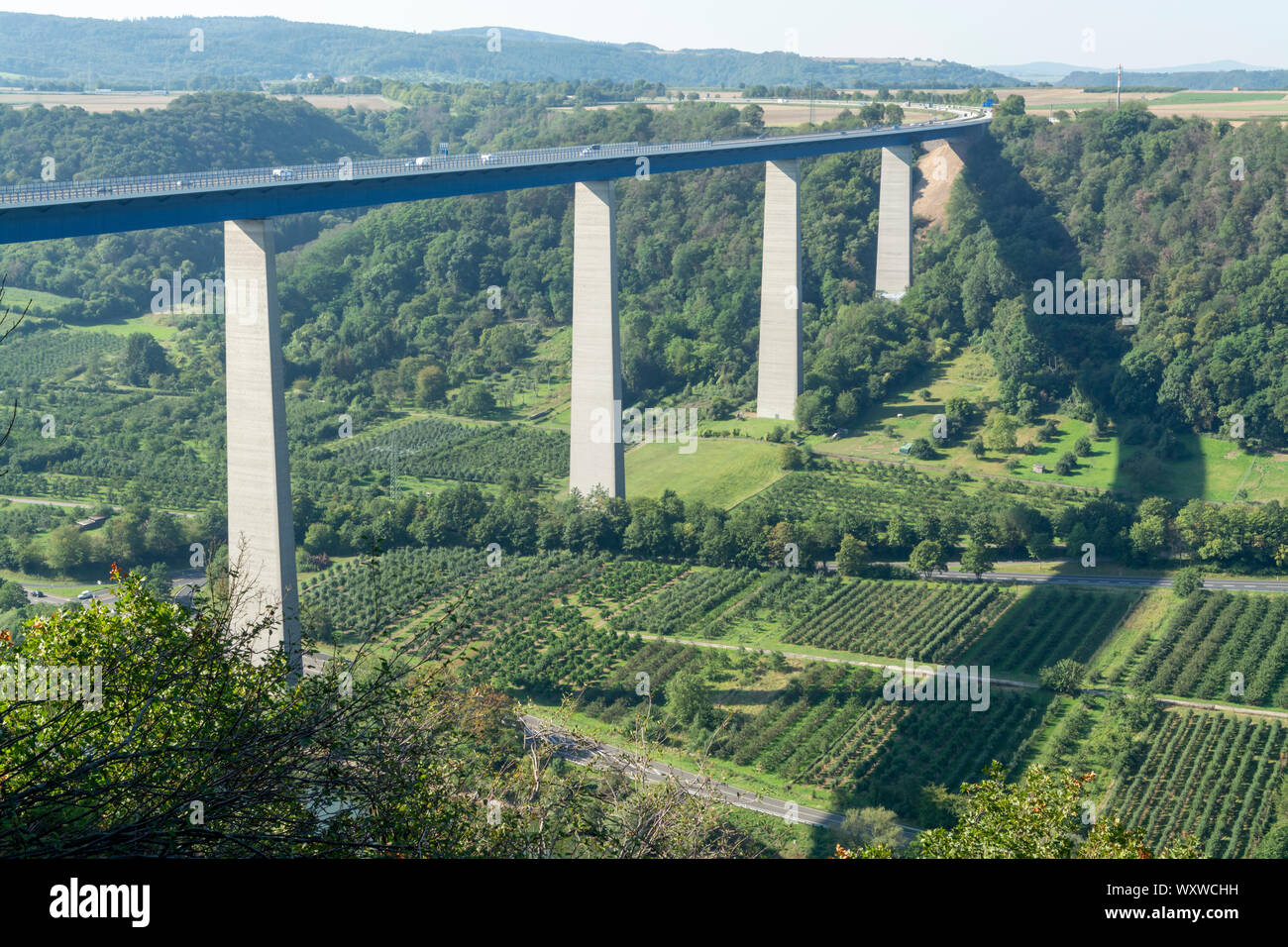 Panoramic view on high freeway viaduct bridge across Mosel river valley ...