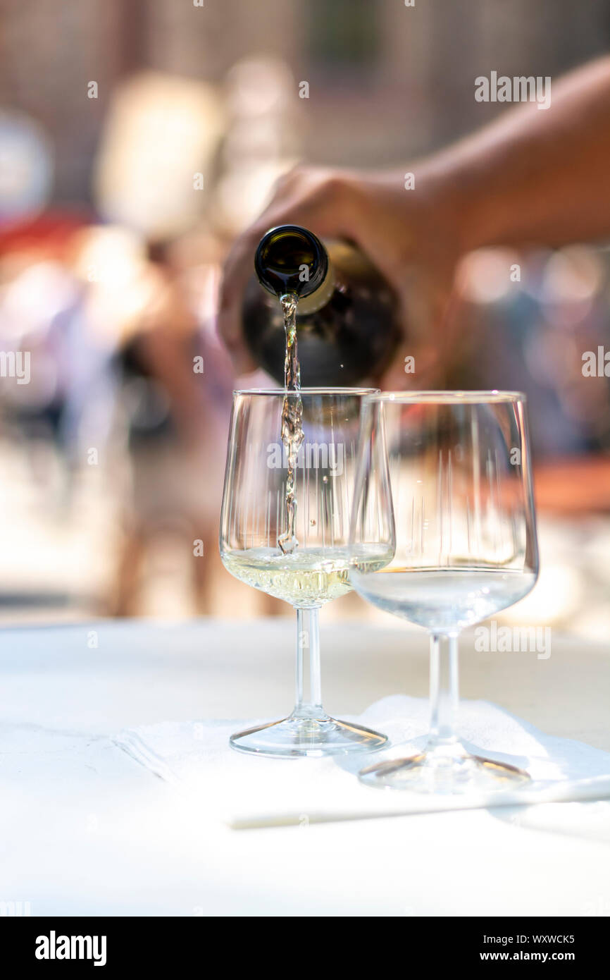 Tasting of cold white dry riesling wine on street wine festival on ...