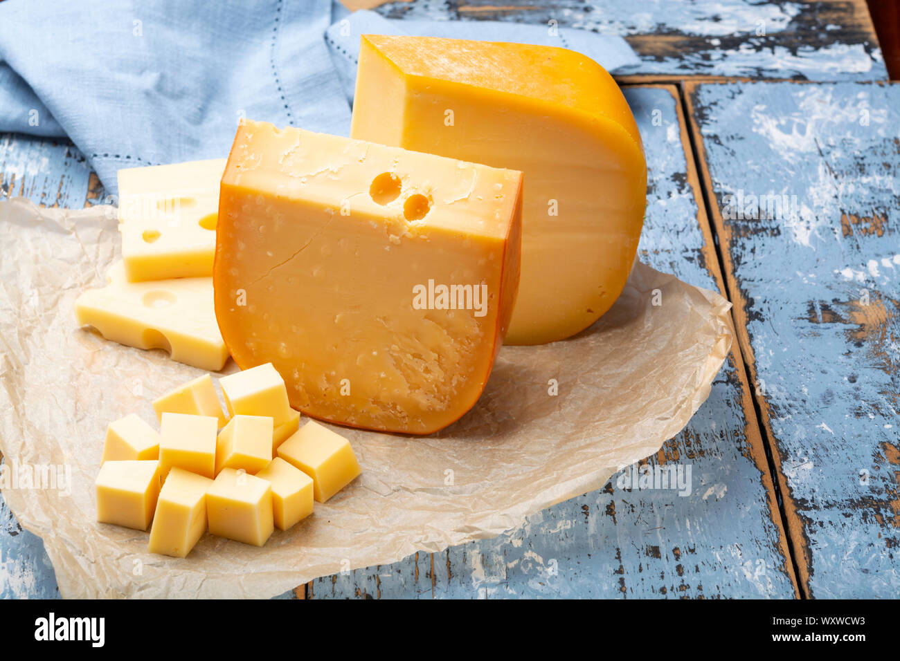 Famous hard cheeses, Dutch Gouda and French Emmentaler in pieces and ...