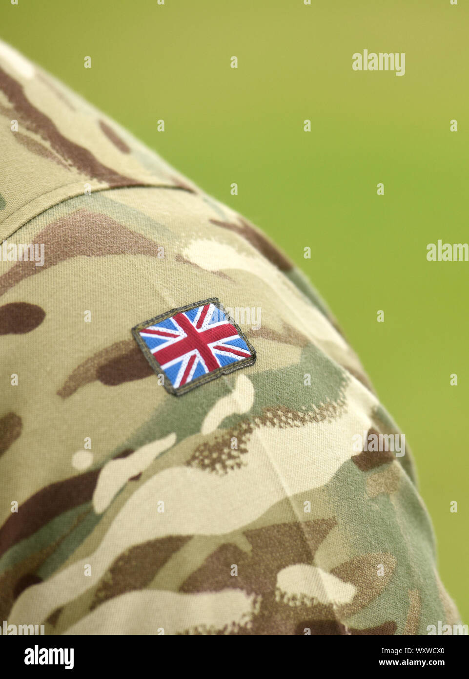 UK flag on soldiers arm. UK military uniform. United Kingdom troops ...