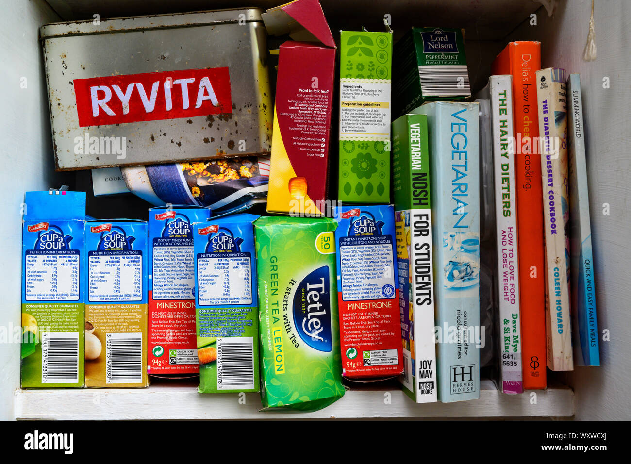 Cupboard in students kitchen Stock Photo - Alamy