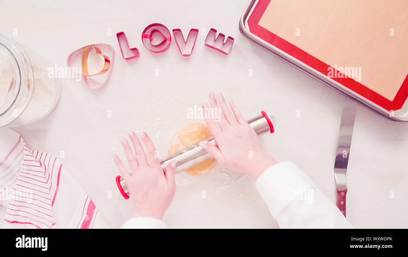 Flat lay. Step by step. Rolling sugar cookie dough with metal rolling pin Stock Photo - Alamy