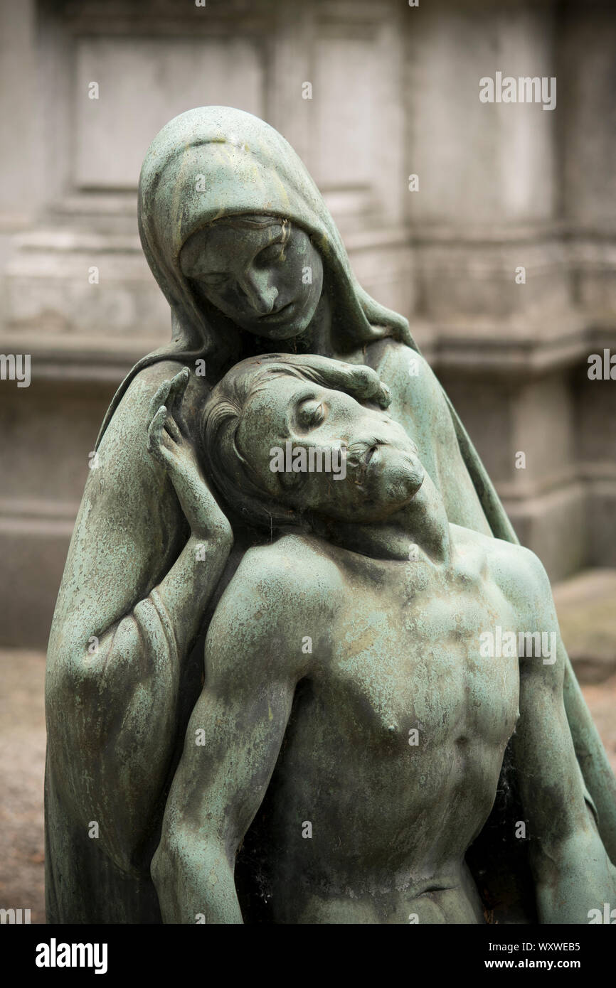 Detail of ancient bronze statue of dead Jesus Christ down from the cross and the Virgin Mary ...