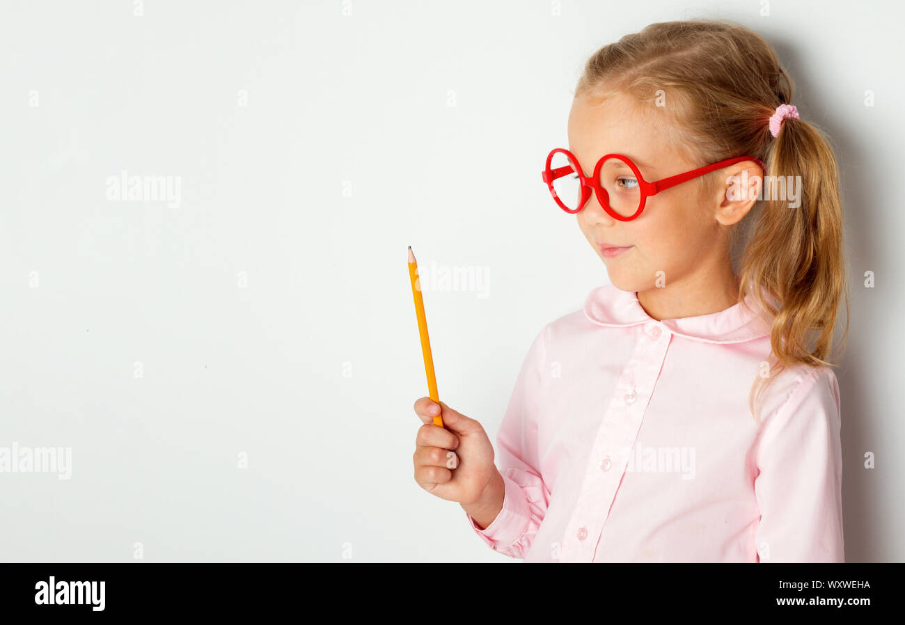 Clever girl with a pencil. Success, idea and creative concept. Back to ...