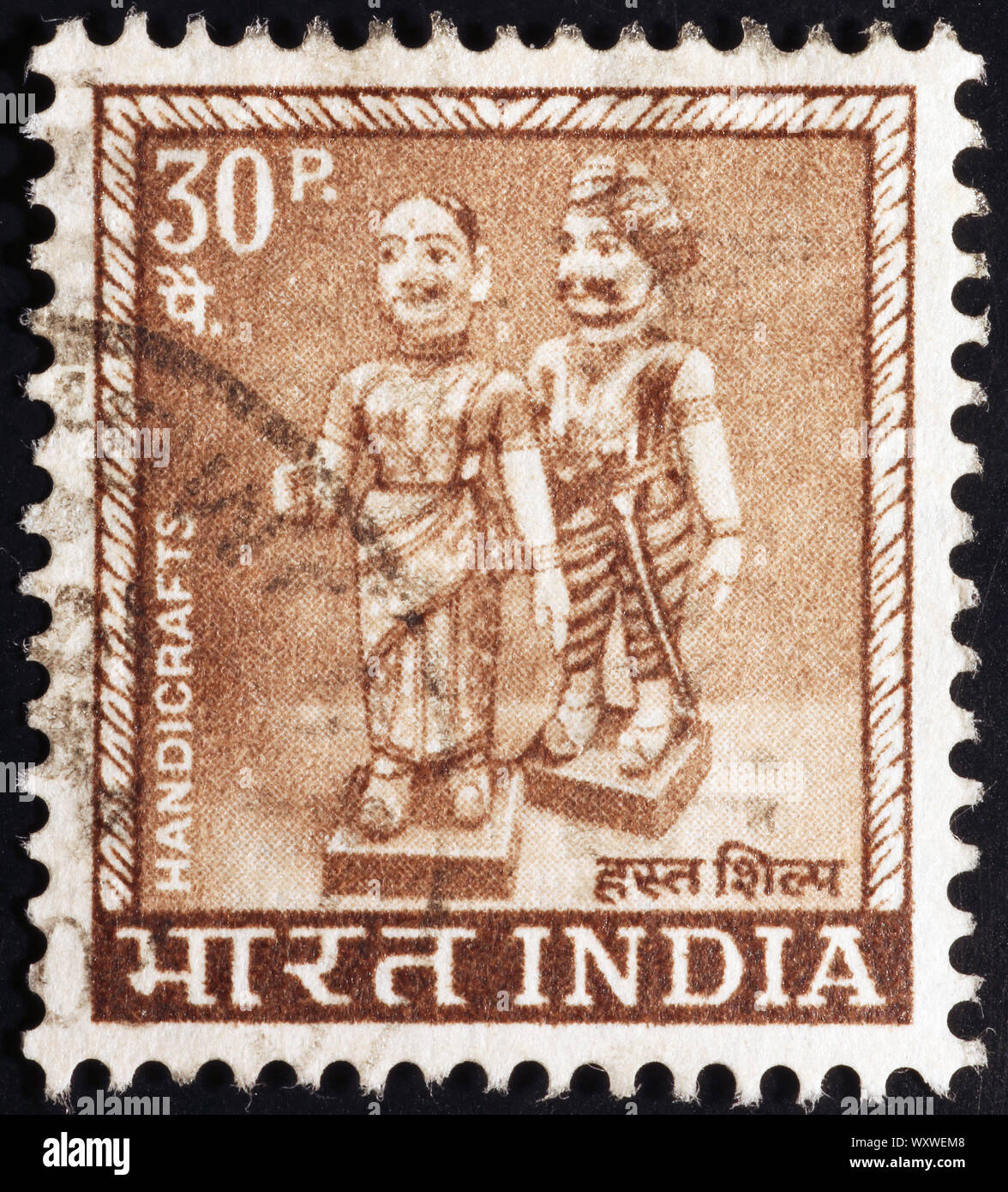 Two statuettes on old indian postage stamp Stock Photo - Alamy
