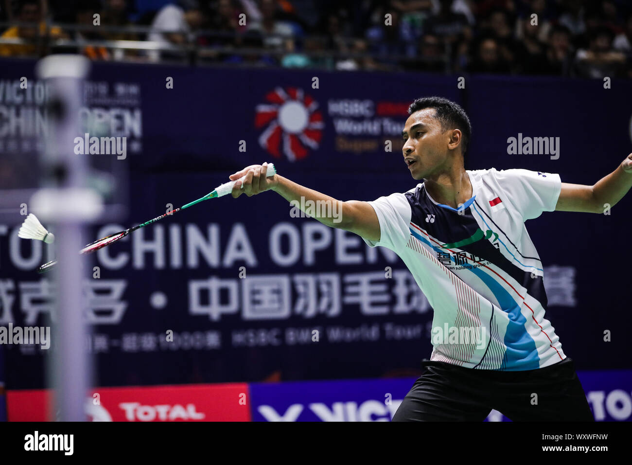 Hong Kong professional badminton player Wong Wing Ki competes against ...
