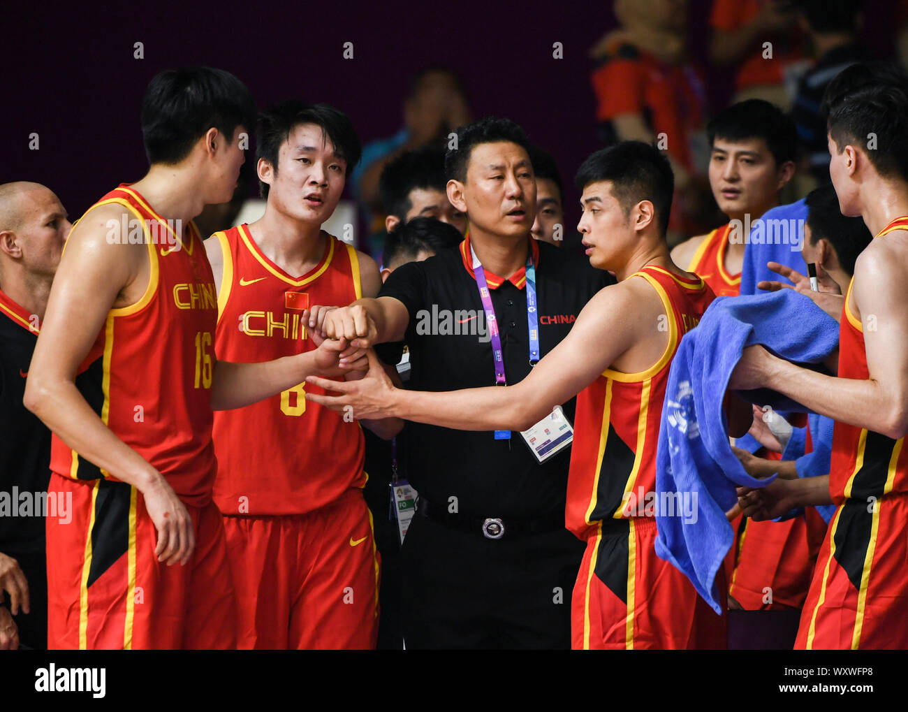--FILE--Coach Li Nan, front, reacts during a game against Philippines ...