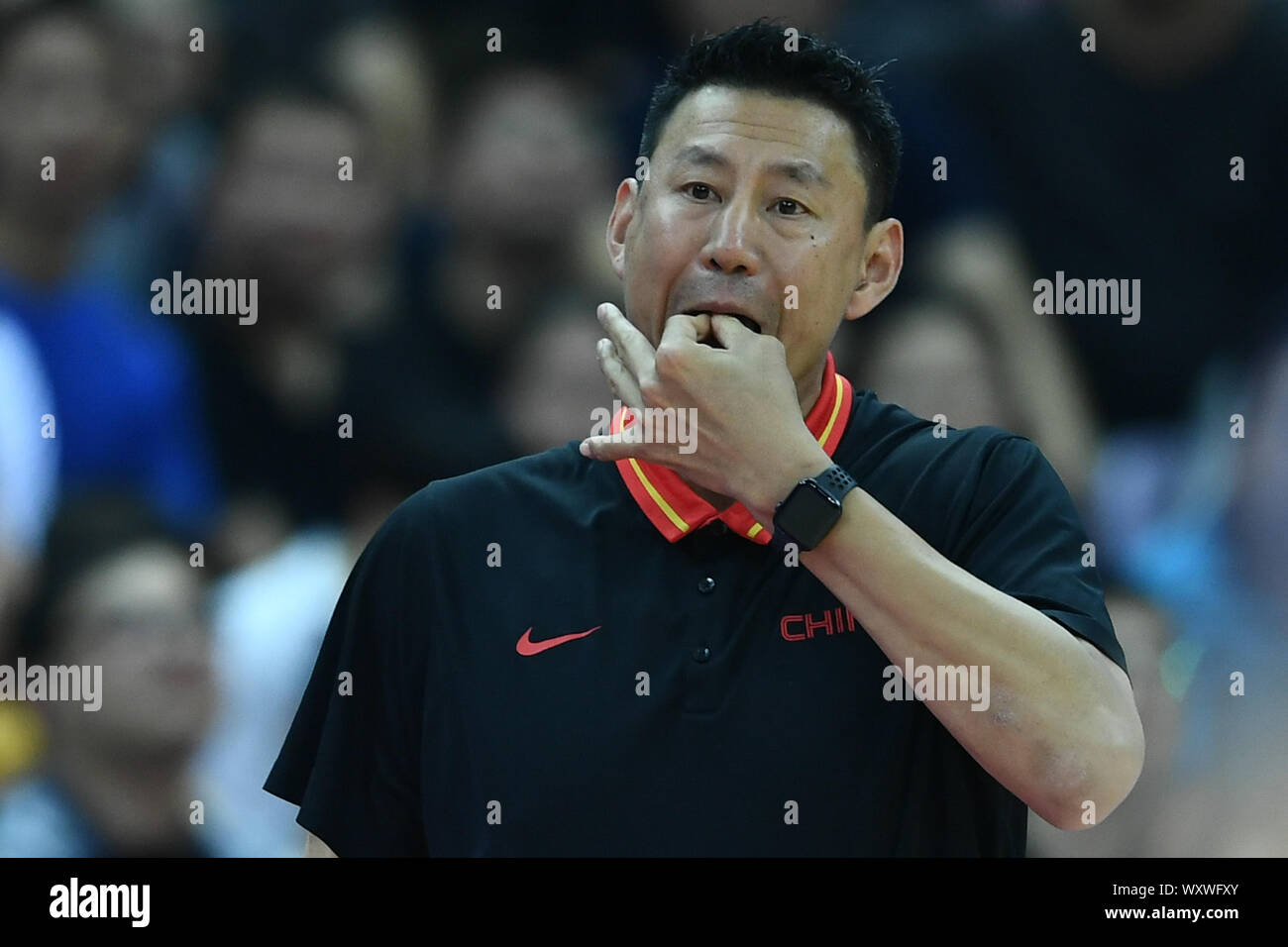 --FILE--Coach Li Nan reacts during a game against Cameroon in Ningbo ...
