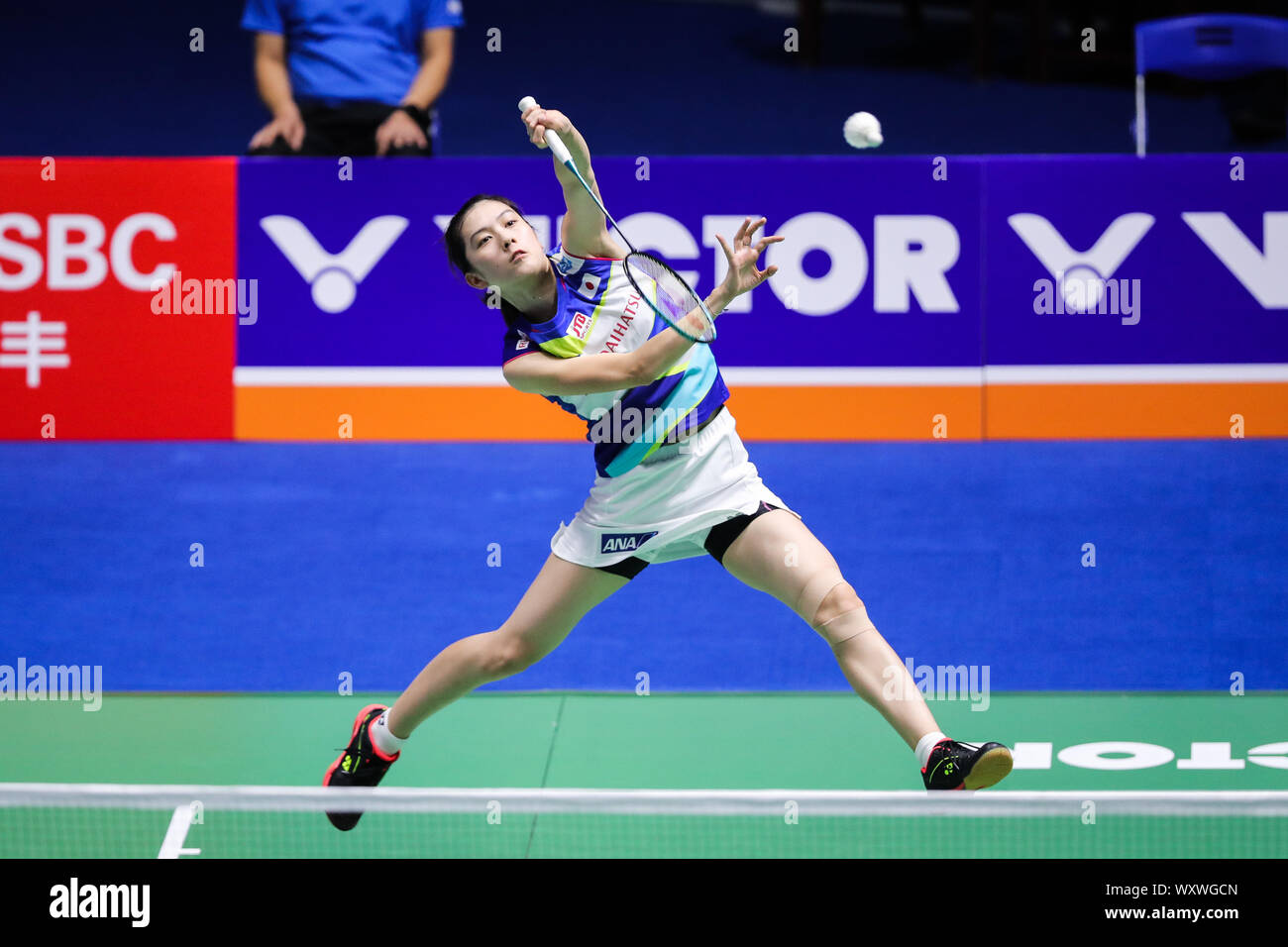 Japanese professional badminton player Aya Ohori competes against Hong ...