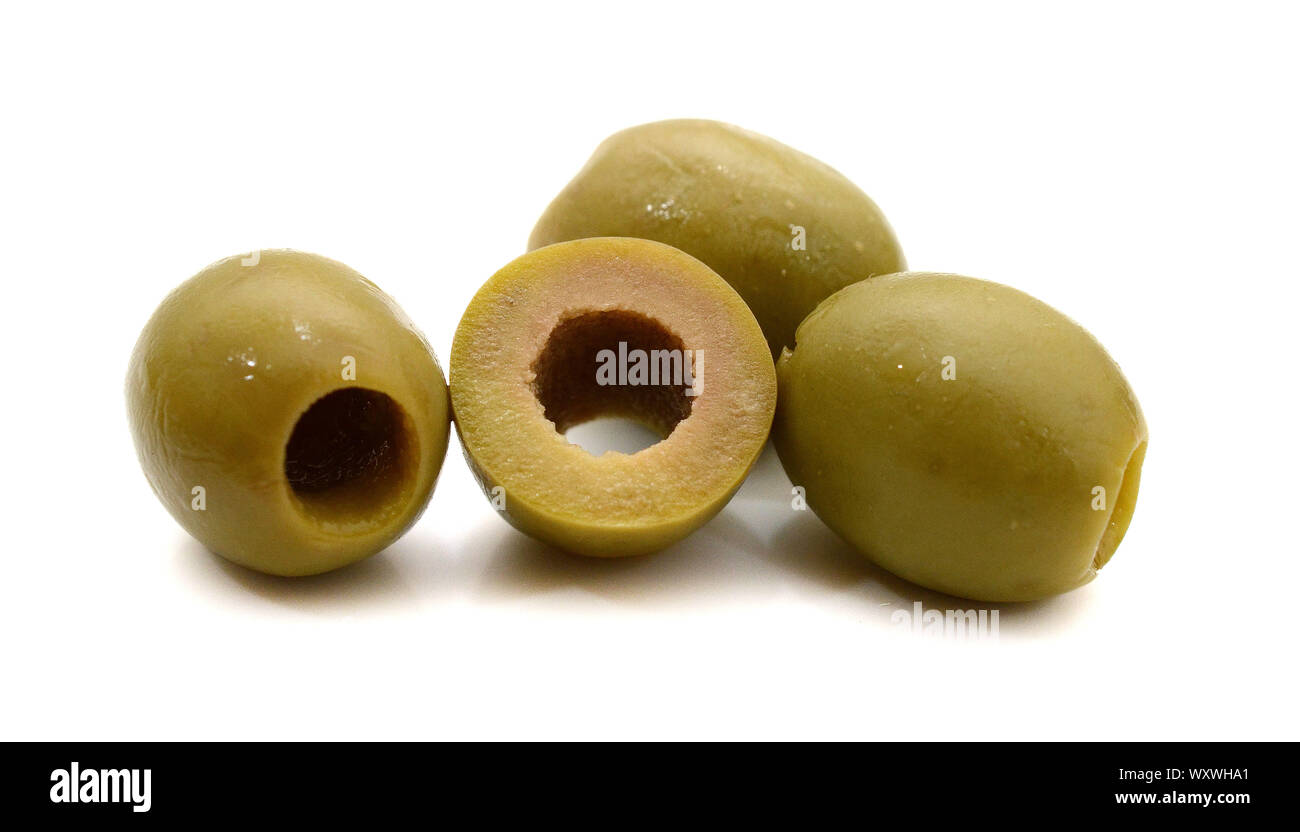 Pitted green olives close up on the white Stock Photo - Alamy