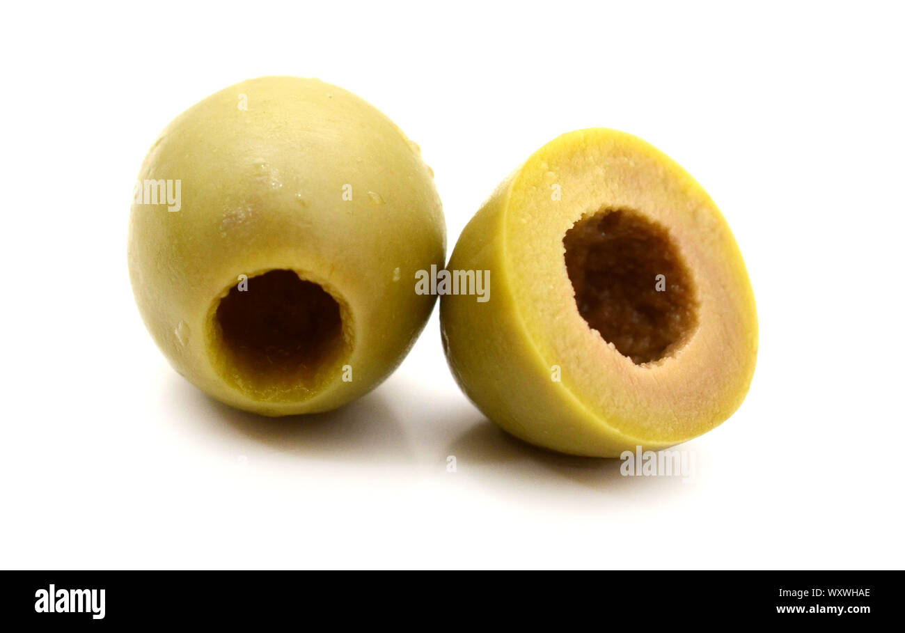 Pitted green olives close up on the white Stock Photo - Alamy