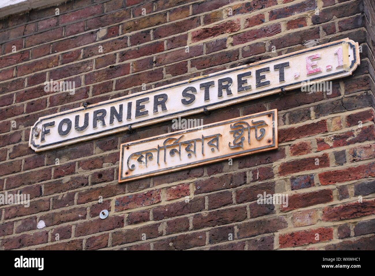 Fournier Street - street in Shoreditch, London, UK. English and Bengali ...