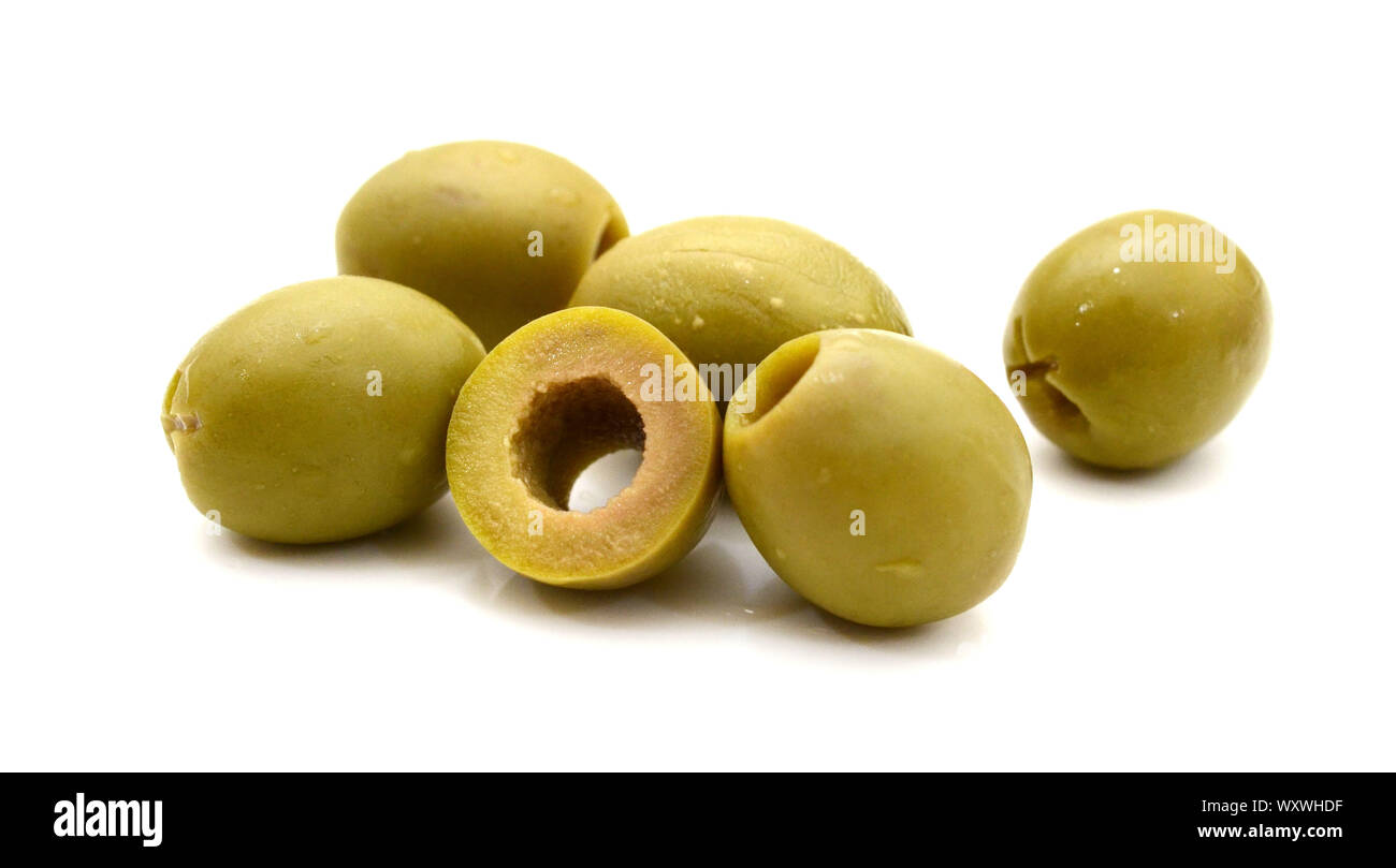 Pickled green olives, tree branch on a white background Stock Photo - Alamy