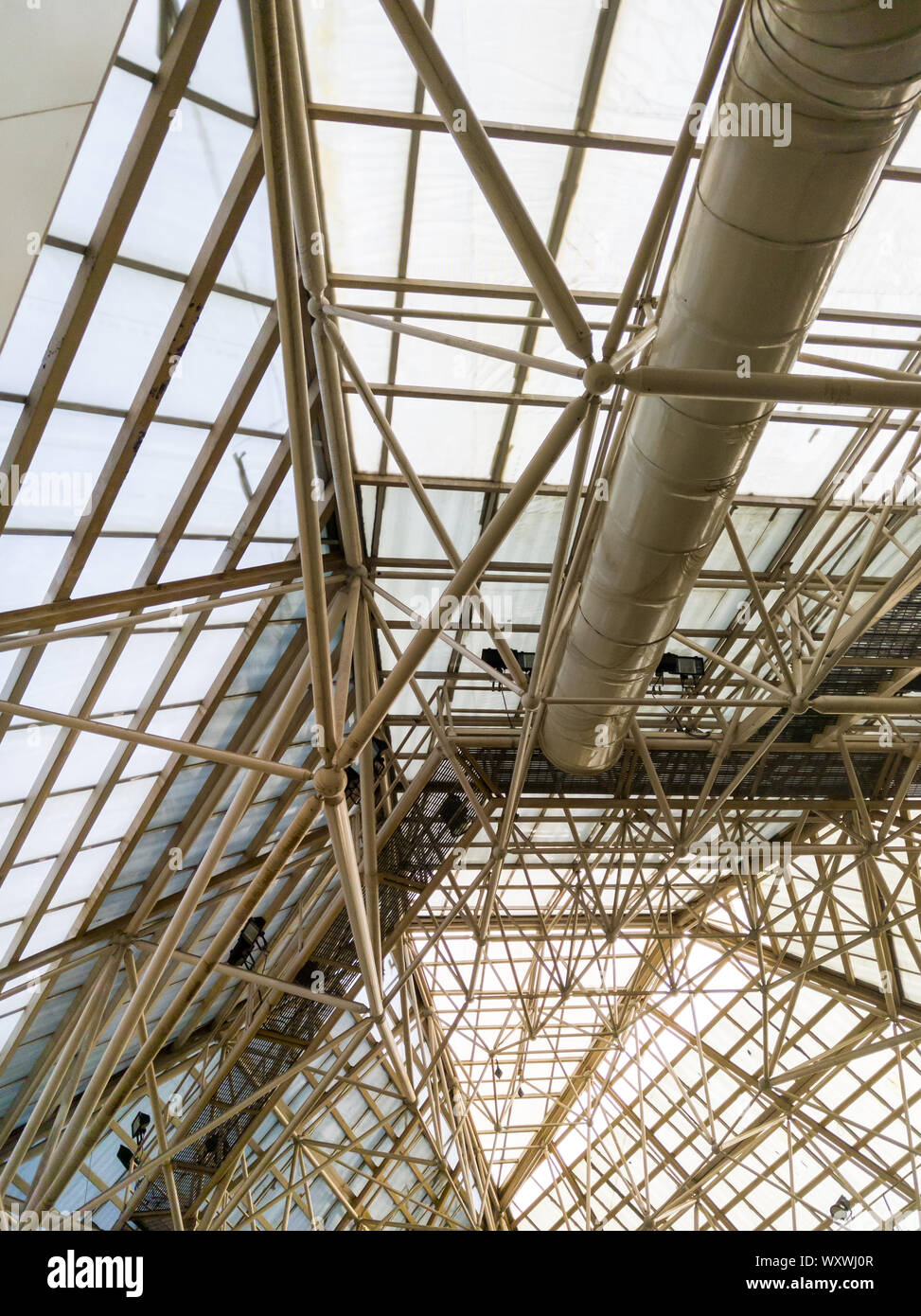 Complex truss frame of the ceiling on the top of the shopping mall with ...