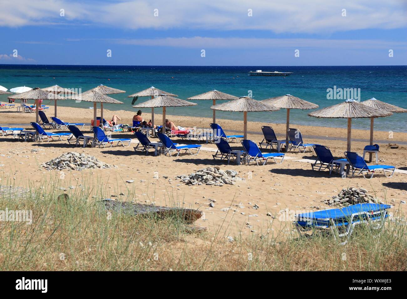 CORFU, GREECE - JUNE 4, 2016: People enjoy the beach in Issos, Corfu ...