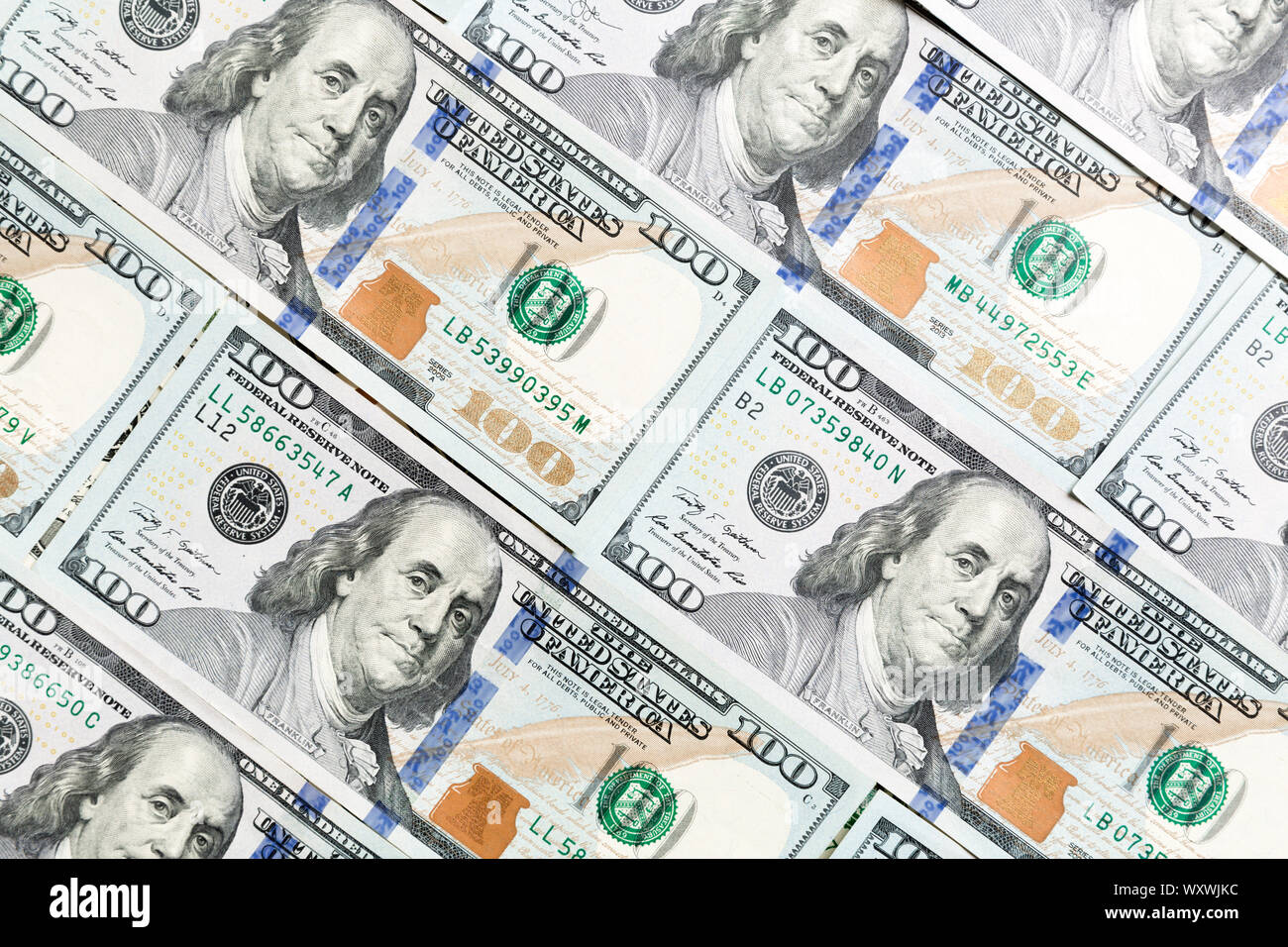 Close up of 100 dollar bills as a background. Amarican dollars pattern ...