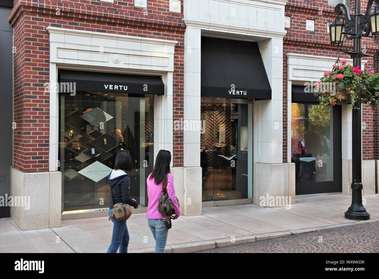 LOS ANGELES, USA - APRIL 5, 2014: Shoppers walk by Vertu store in ...