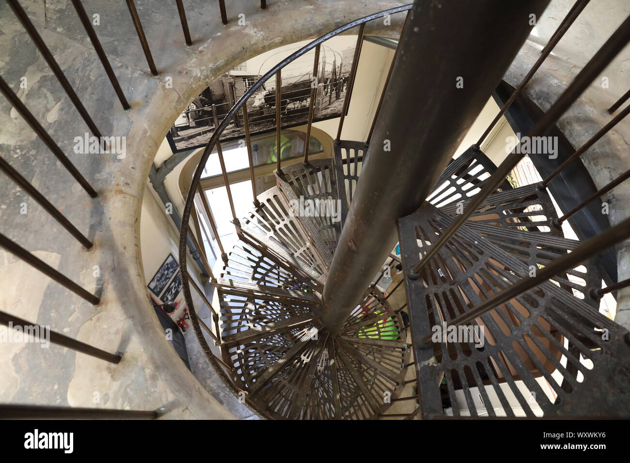 Historic pictures and photos line the walls of the spiral staircase in ...