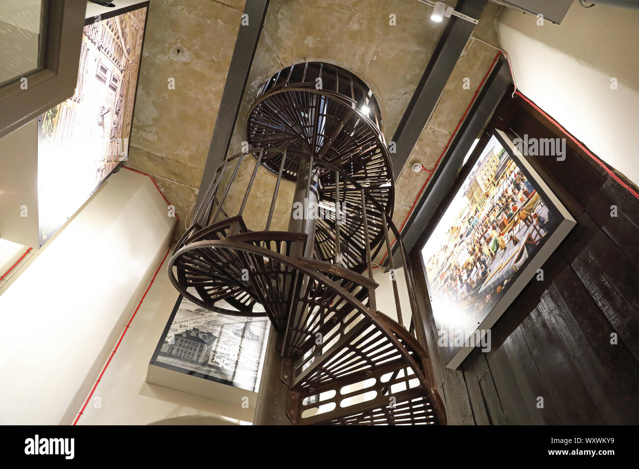Historic pictures and photos line the walls of the spiral staircase in ...