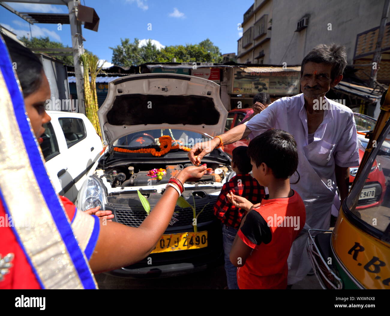 Kolkata, India. 18th Sep, 2019. Hindu people pray in front of their ...