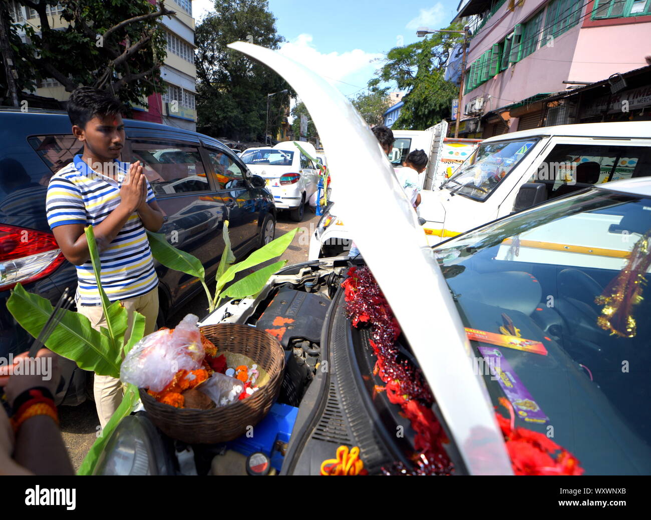 Kolkata, India. 18th Sep, 2019. Hindu people pray in front of their ...
