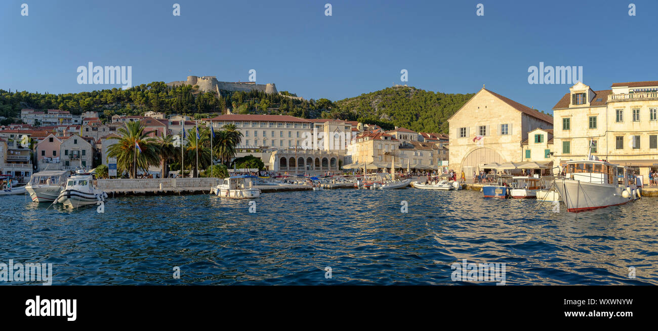 The Spanish Fortress looking onto the port of Hvar at golden hour in ...