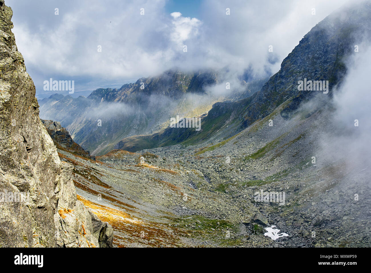 Scene from high mountains with peaks and hiking trails Stock Photo - Alamy