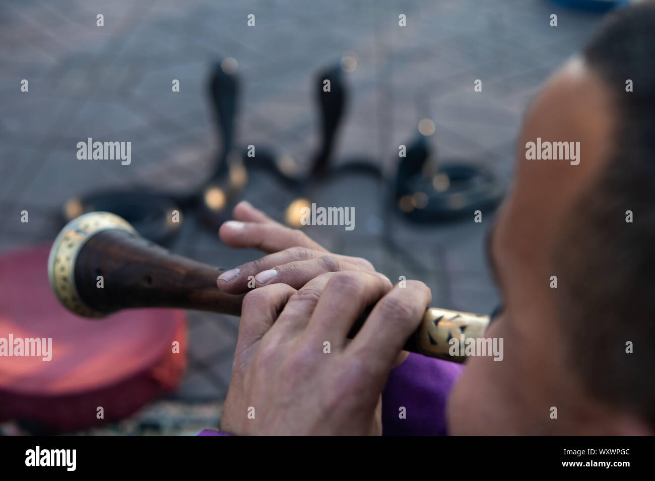 Moroccan Cobra enchanter sitting in the street with his cobra ...