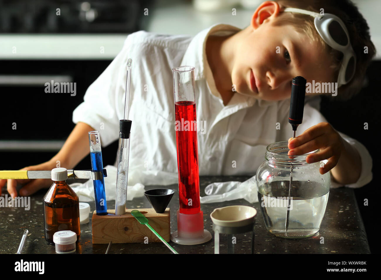 Young scientist chemist surprised while making his scientific ...