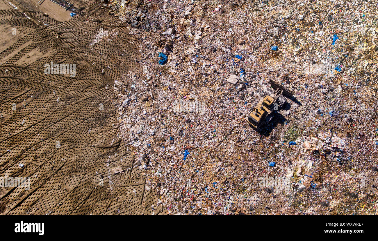 trash being worked at the landfill by heavy equipment Stock Photo - Alamy