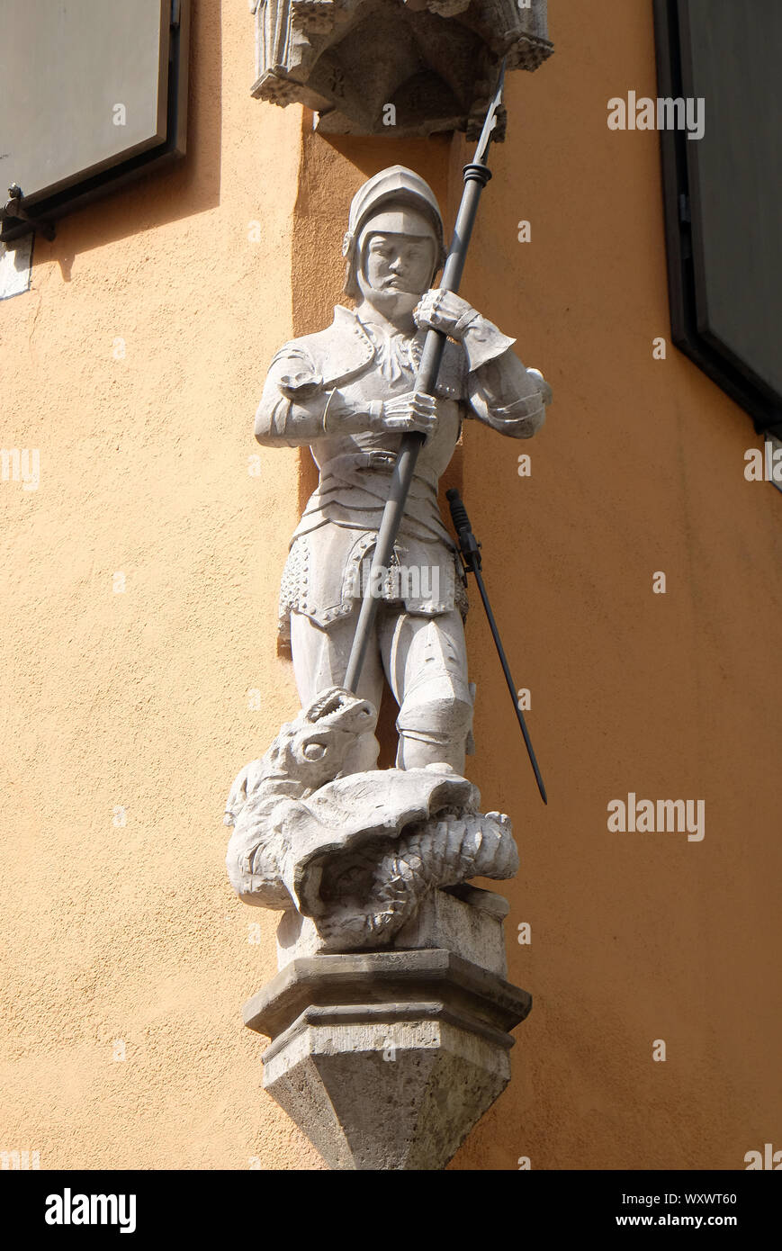 Saint George slaying the dragon, statue on the house facade in ...