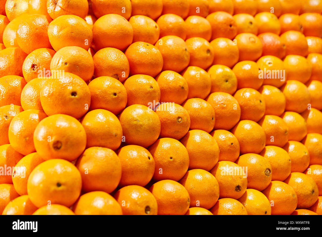 Stack of oranges in the fruit section for healthy eating and vitamins ...