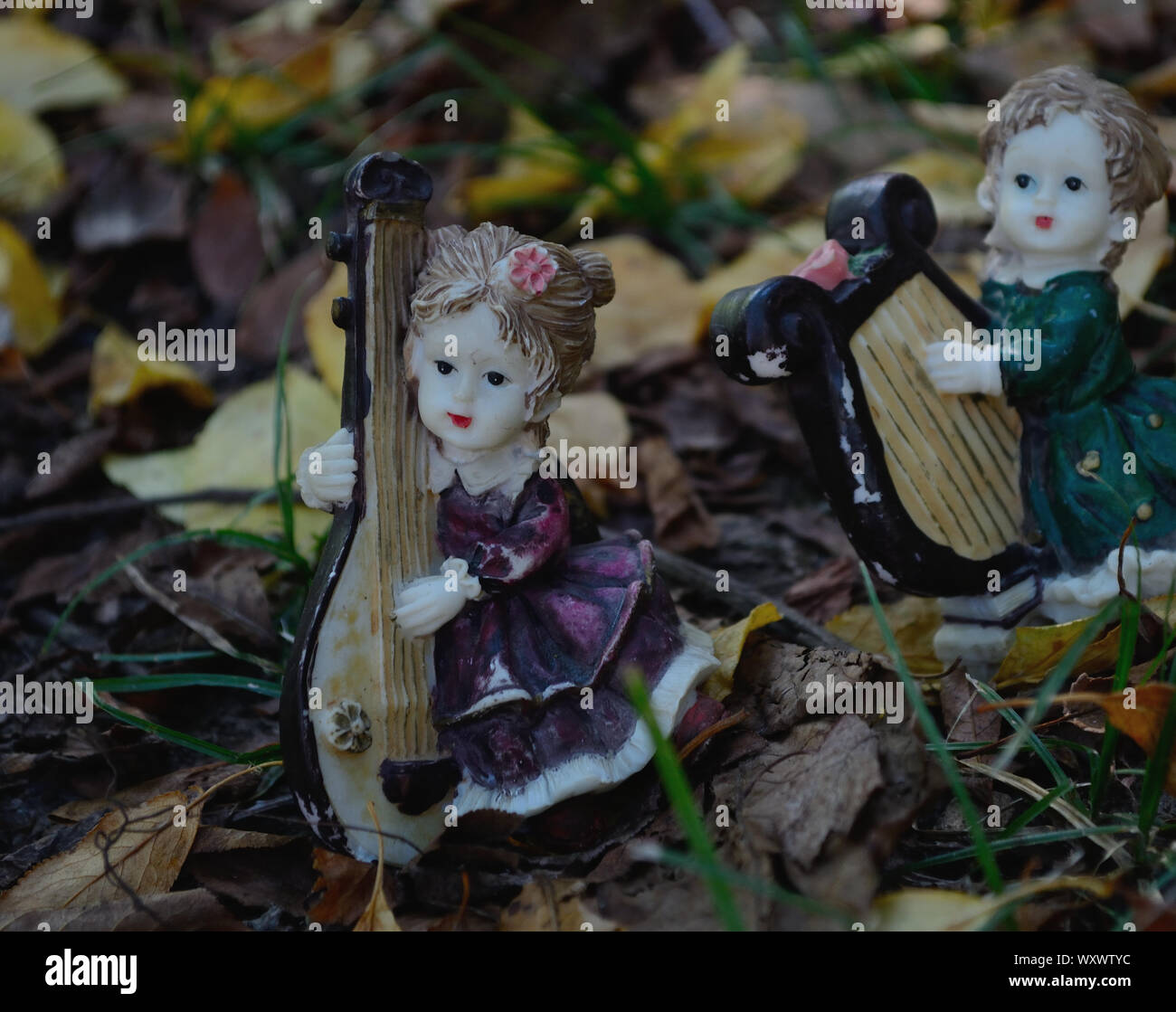 Vintage musicians porcelain dolls on the ground Stock Photo - Alamy