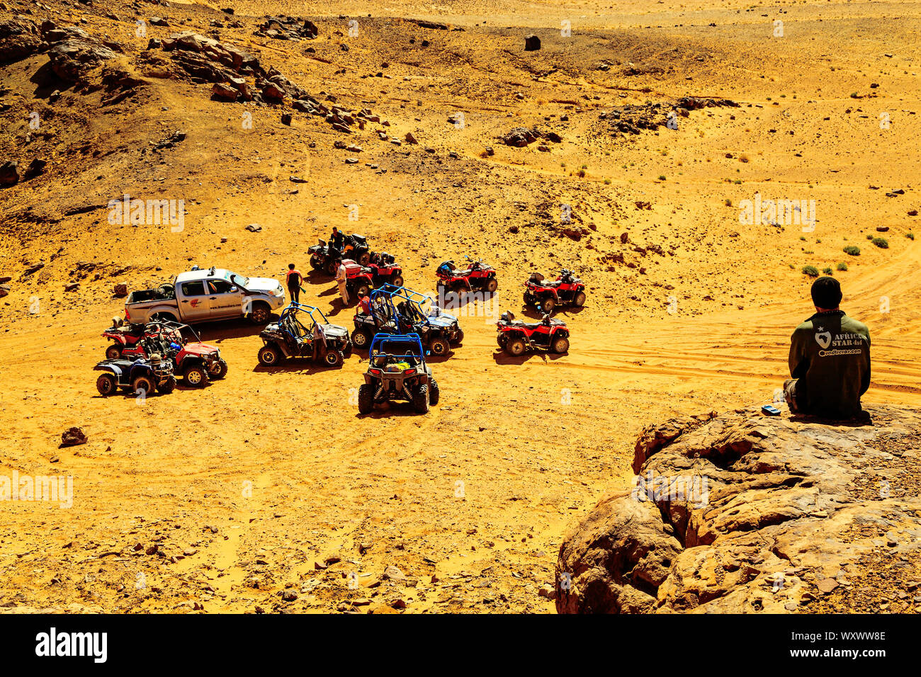 Merzouga, Morocco - February 26, 2016: Rear view of man sitting on ...
