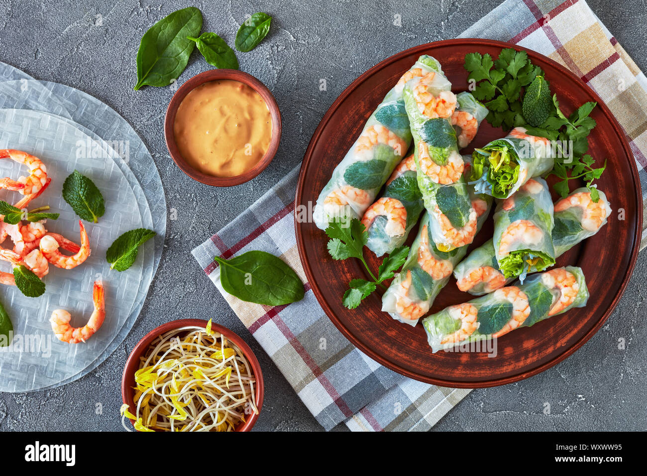 close-up of raw Asian spring rolls of rice paper with shrimps, rice ...