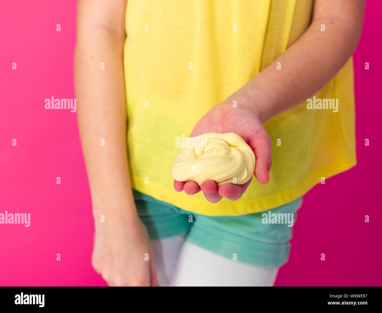 two beautiful girls playing with homemade slime and having a lot of fun ...