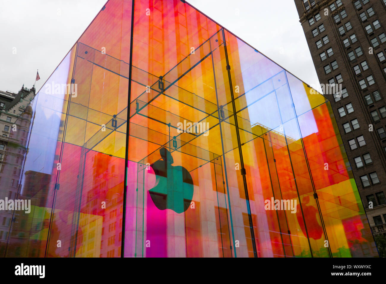 The iconic Apple store glass cube is in a temporary iridescent wrap ...