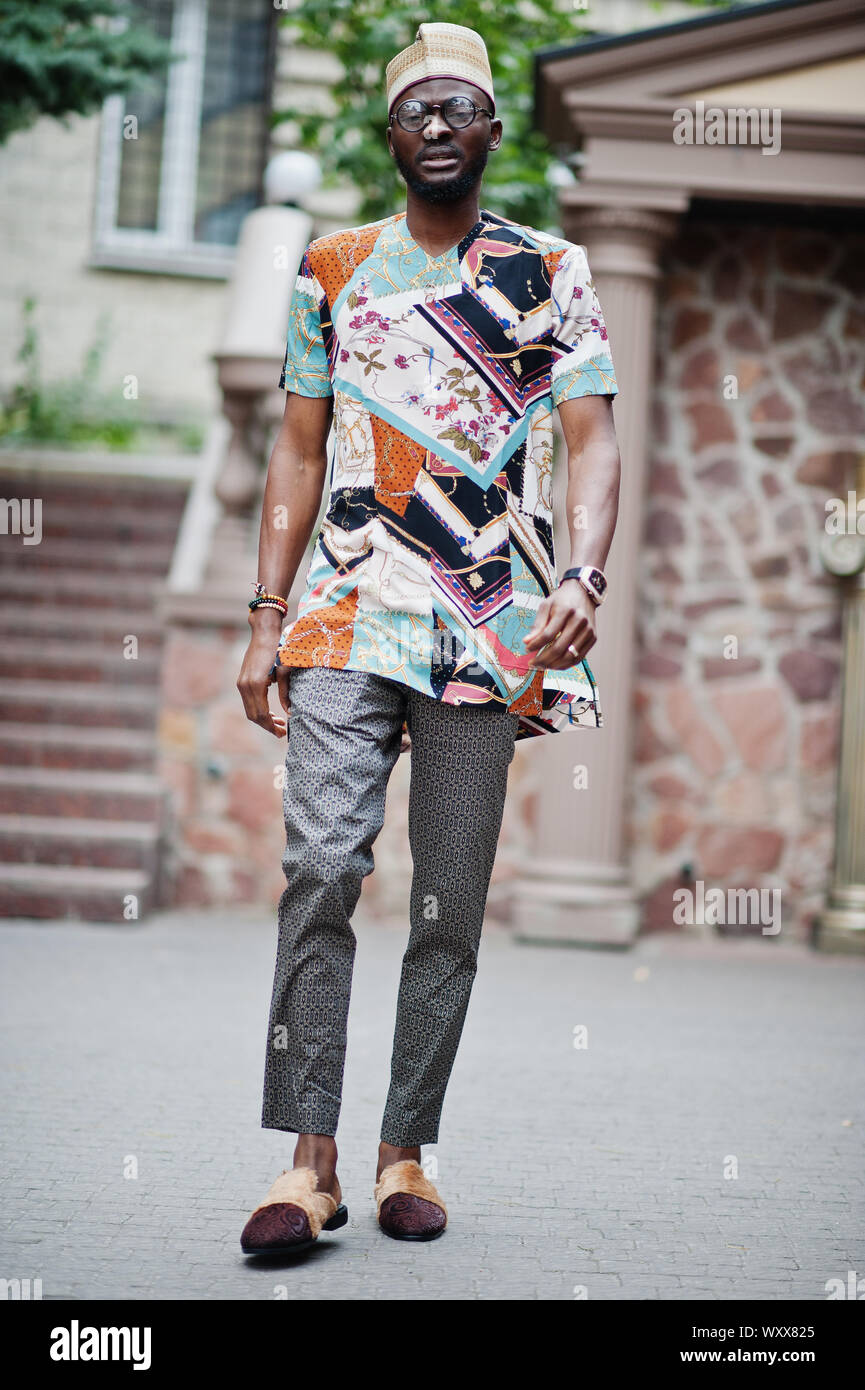 Handsome afro american man wearing traditional clothes, cap and ...