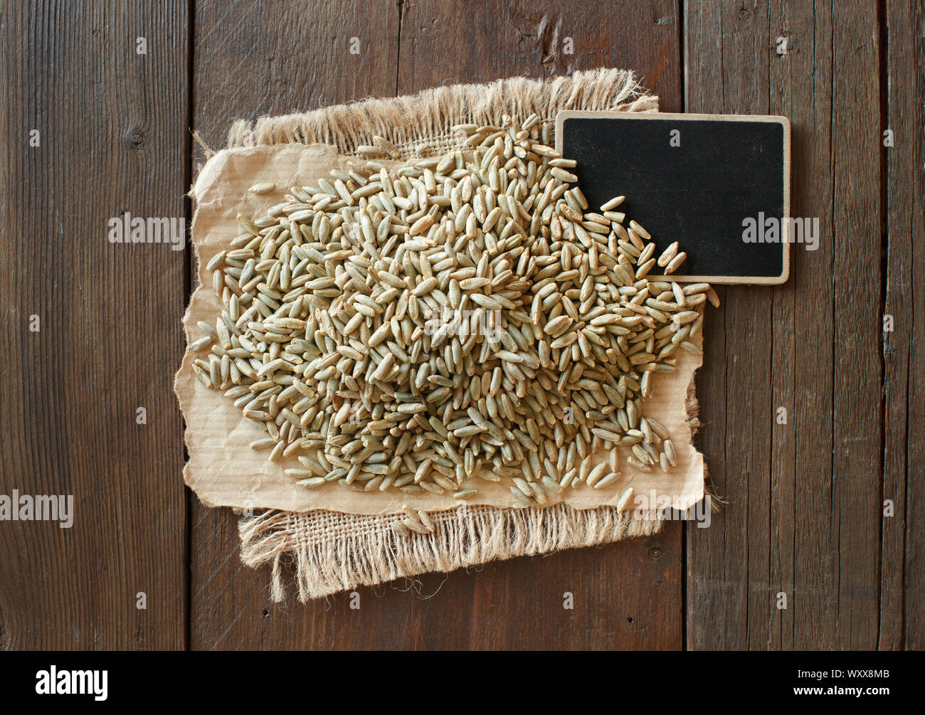Pile of Dry Raw Rye Grain with a small chalkboard Stock Photo - Alamy