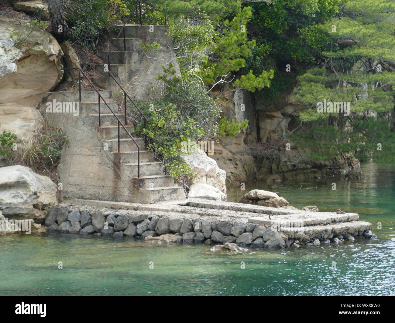 An island with steps leading from the pier Stock Photo - Alamy