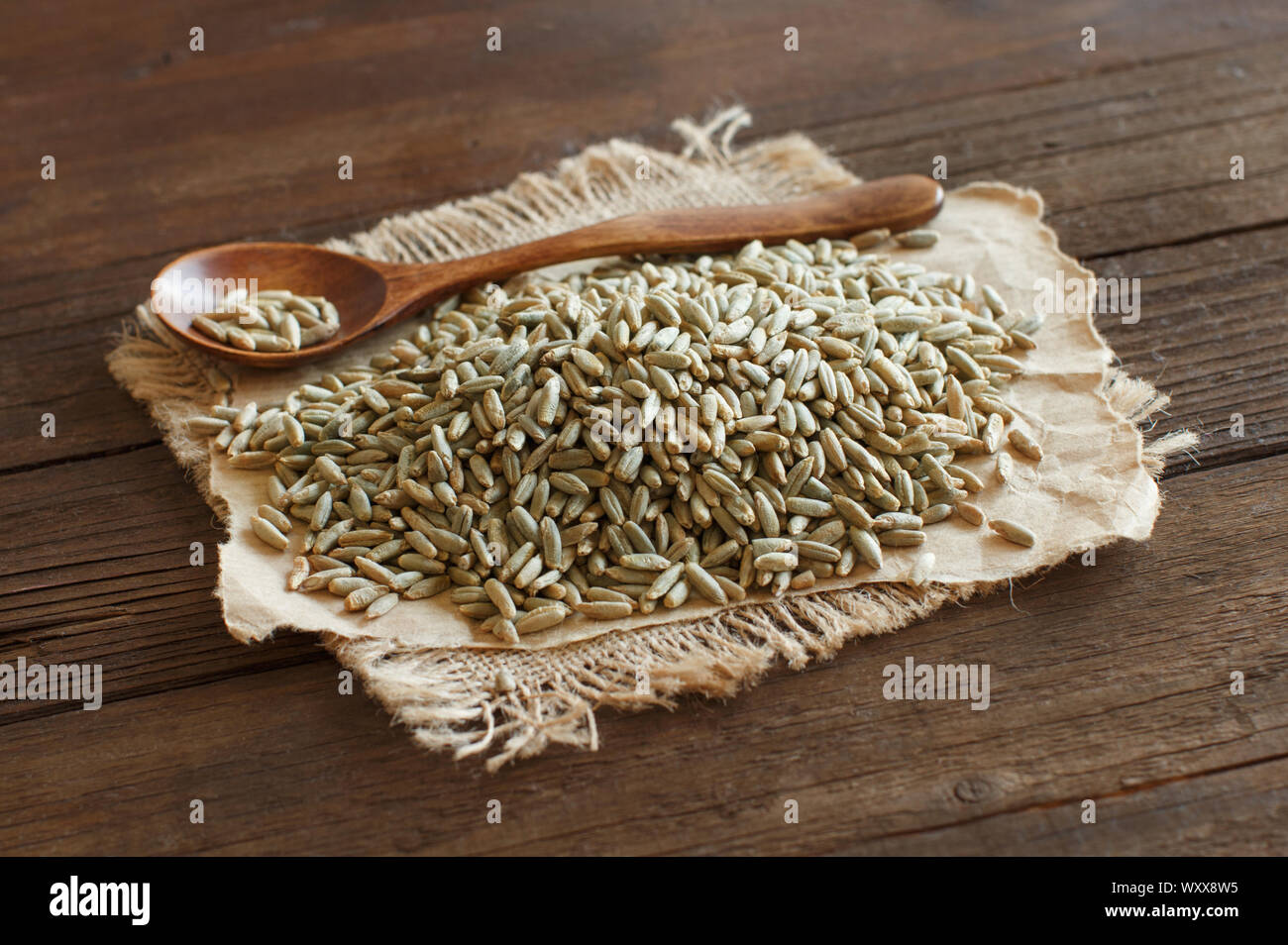 Pile of Dry Raw Rye Grain on wood Stock Photo - Alamy