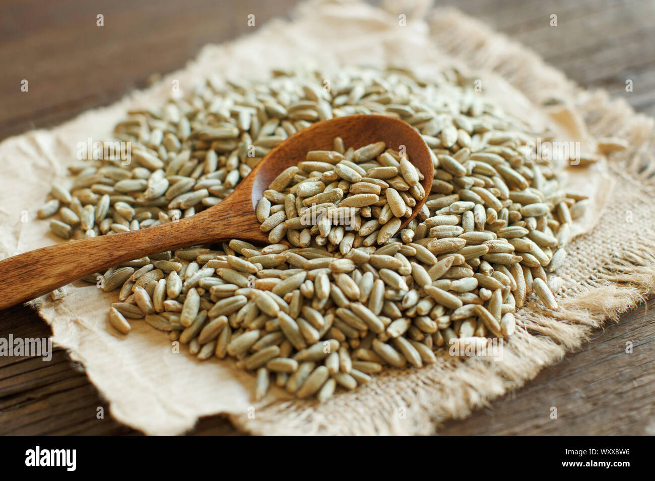 Pile of Dry Raw Rye Grain with a spoon Stock Photo - Alamy