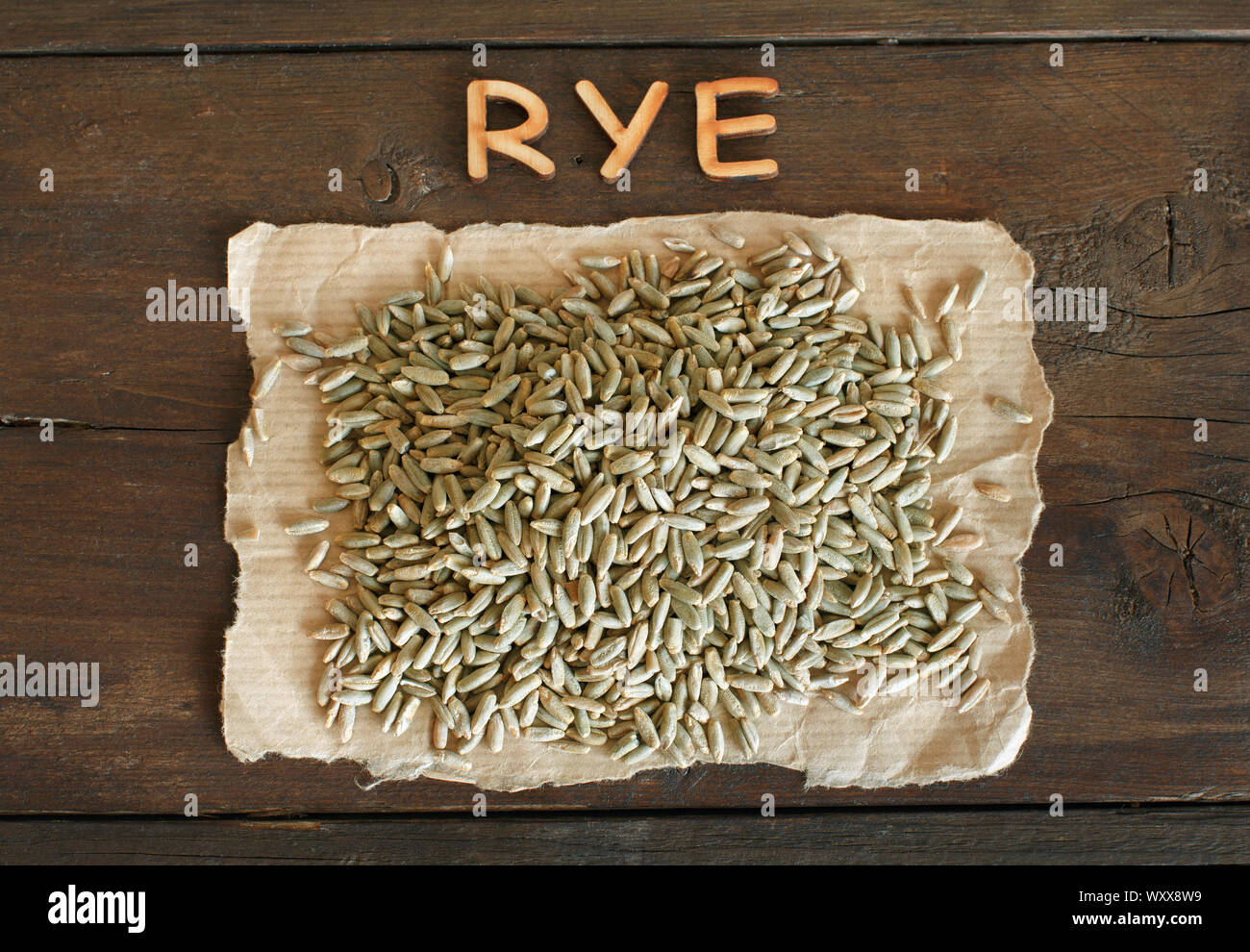 Pile of Dry Raw Rye Grain with wooden letters Stock Photo - Alamy