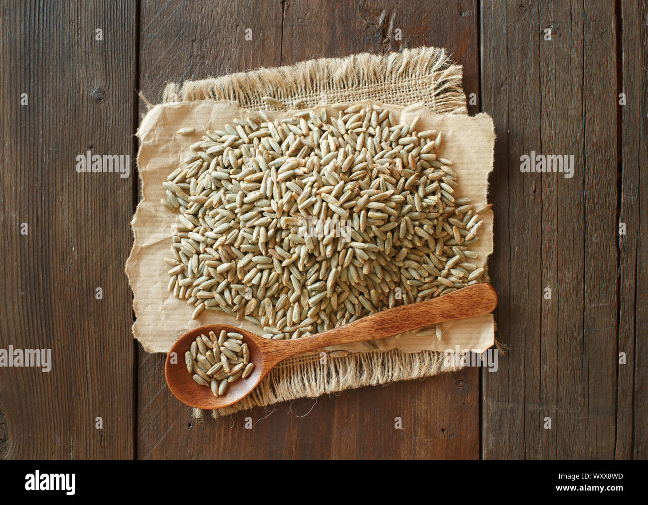 Pile of Dry Raw Rye Grain with a spoon Stock Photo - Alamy