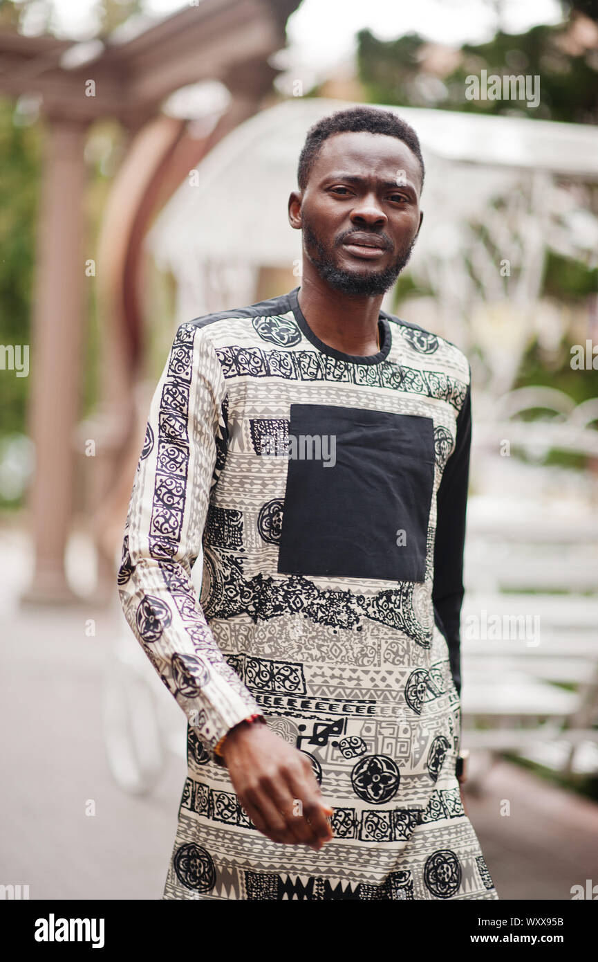 Handsome afro american man wearing traditional clothes in modern city ...
