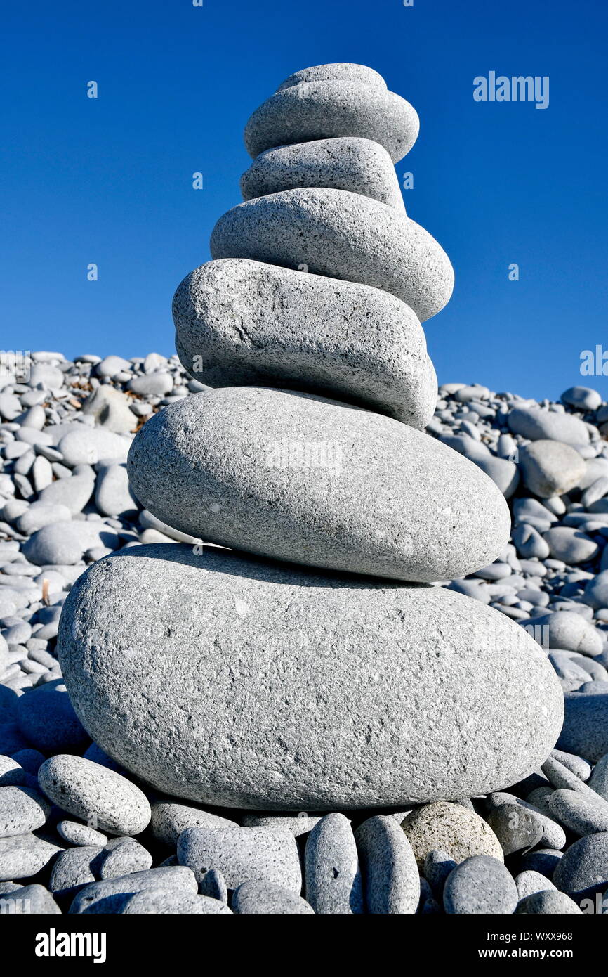 Stack of pebbles on a beach, cairn Stock Photo - Alamy