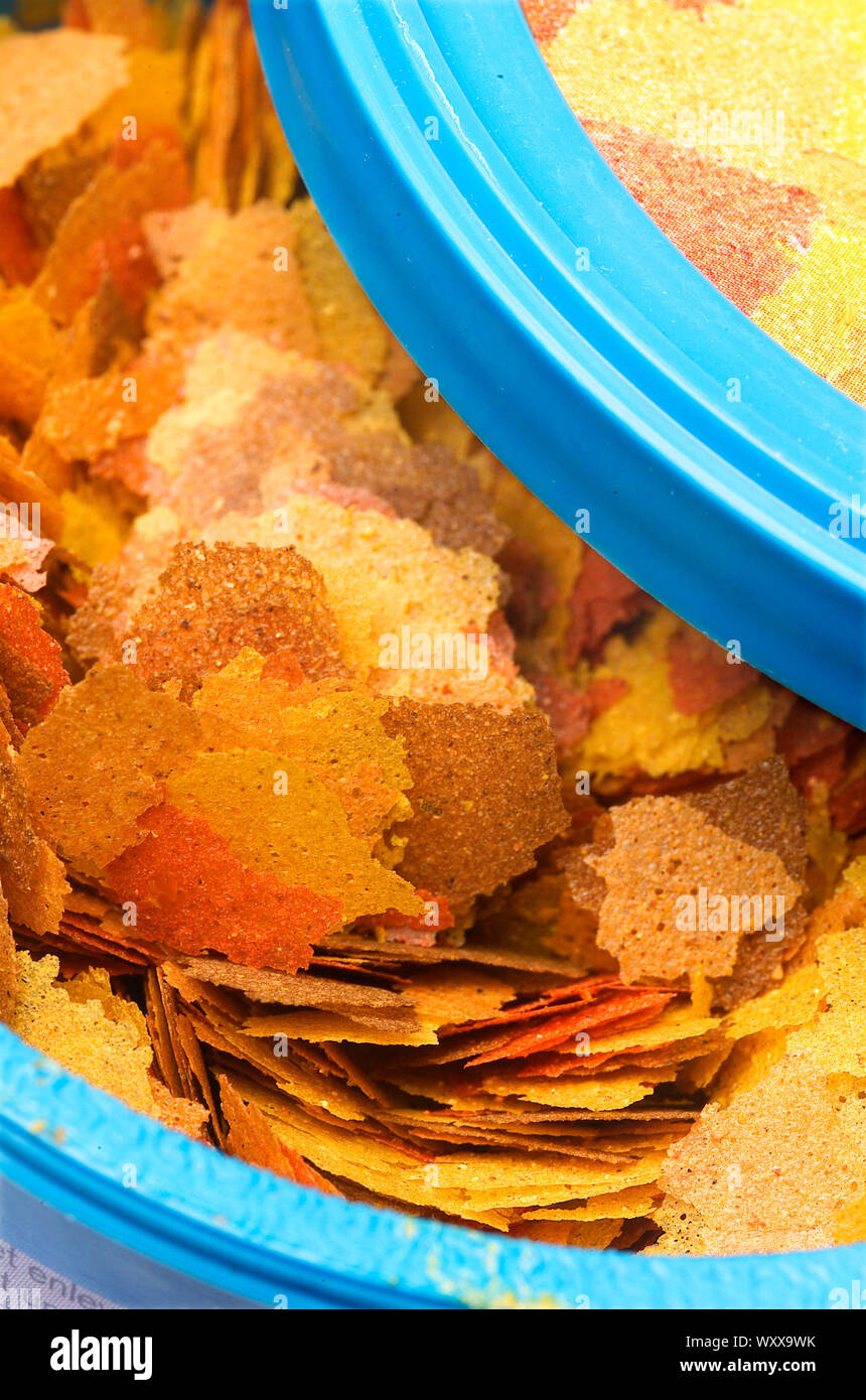Fish food flakes Stock Photo - Alamy