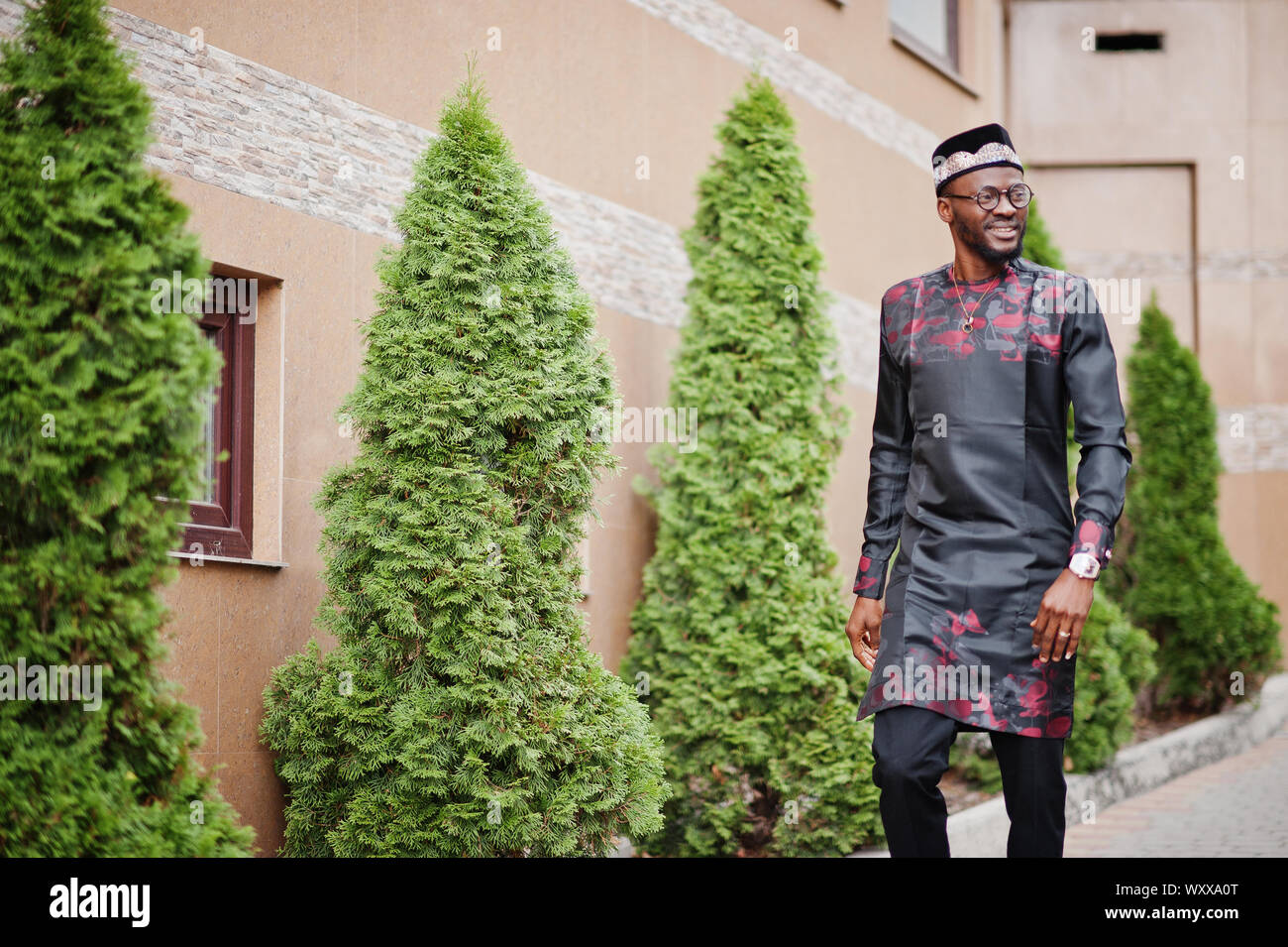 Handsome afro american man wearing traditional clothes, cap and ...